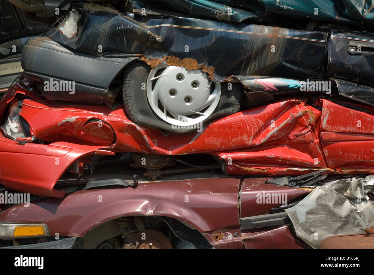 Smashed and crushed automobiles and parts in an Auto Salvage yard Stock ...