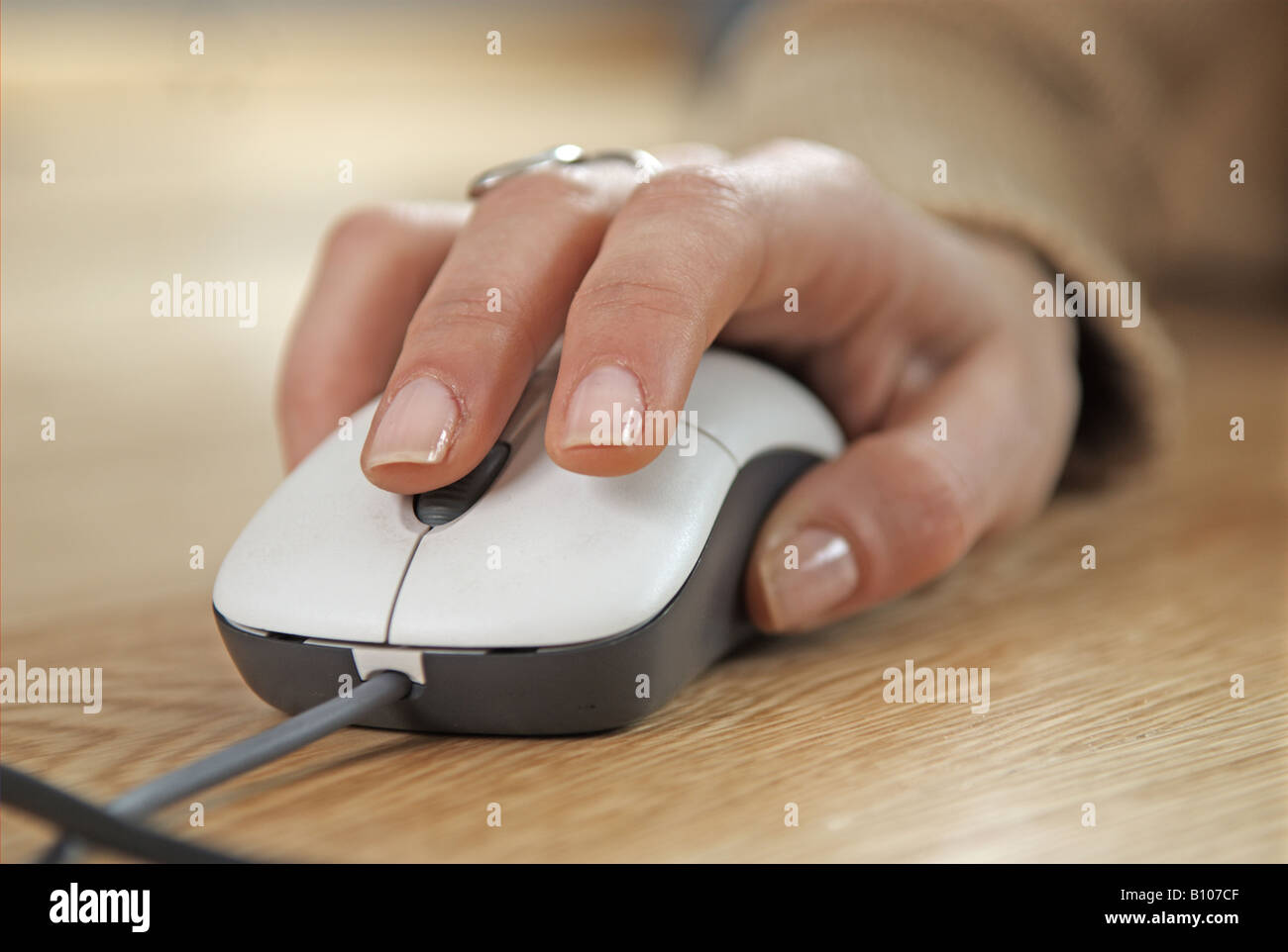 Hand with mouse Stock Photo - Alamy