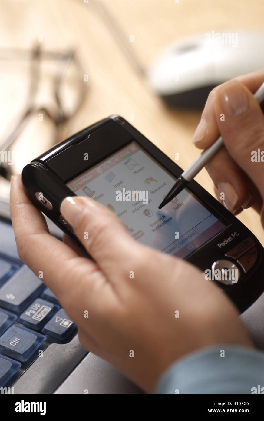 Woman using a pda phone Stock Photo - Alamy