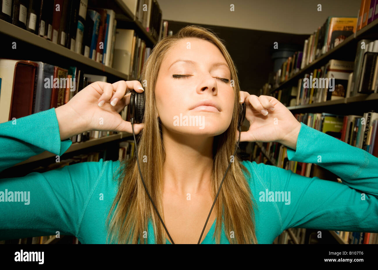 Student listening to music Stock Photo - Alamy