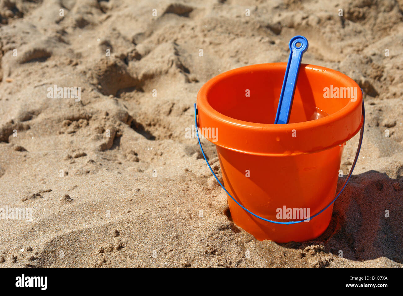 Beach bucket at the sand Stock Photo - Alamy
