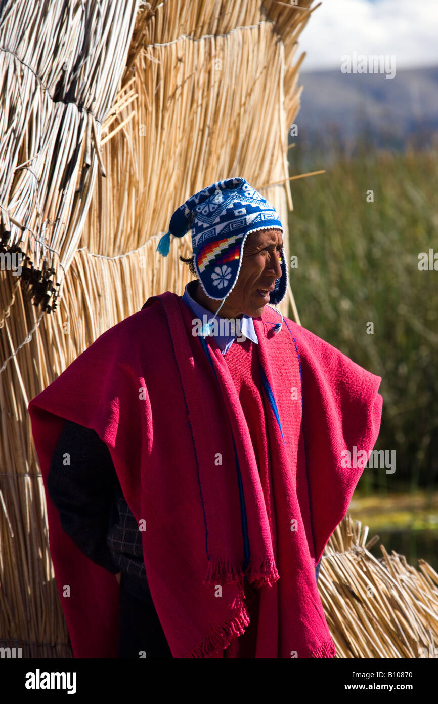 Local man at a traditional Urus Iruitos reed village on the banks of ...