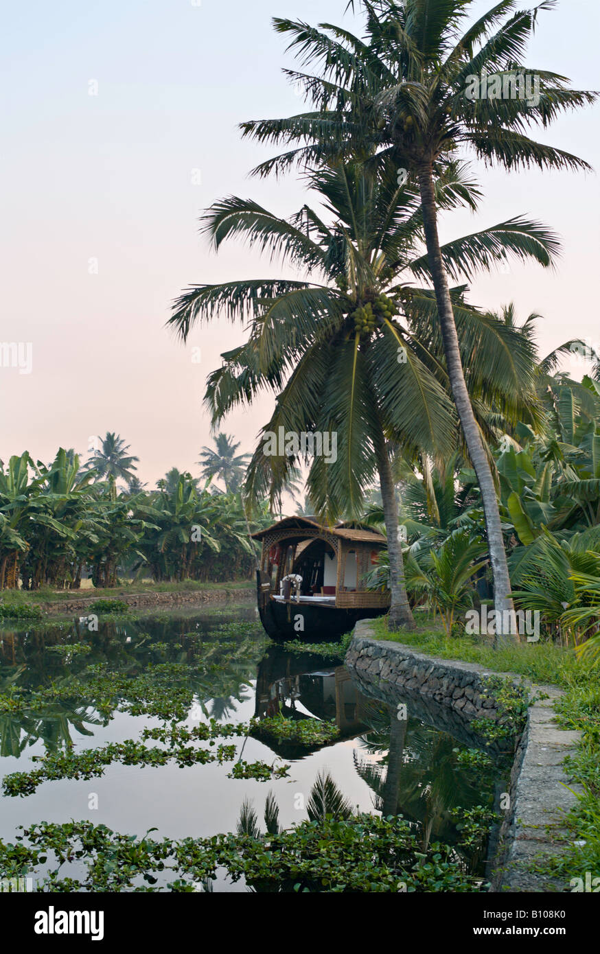 INDIA KERALA Renovated rice boat on canal in the backwaters of Kerala ...