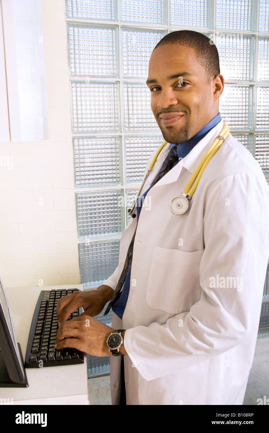 Male doctor entering medical exam hi-res stock photography and images ...