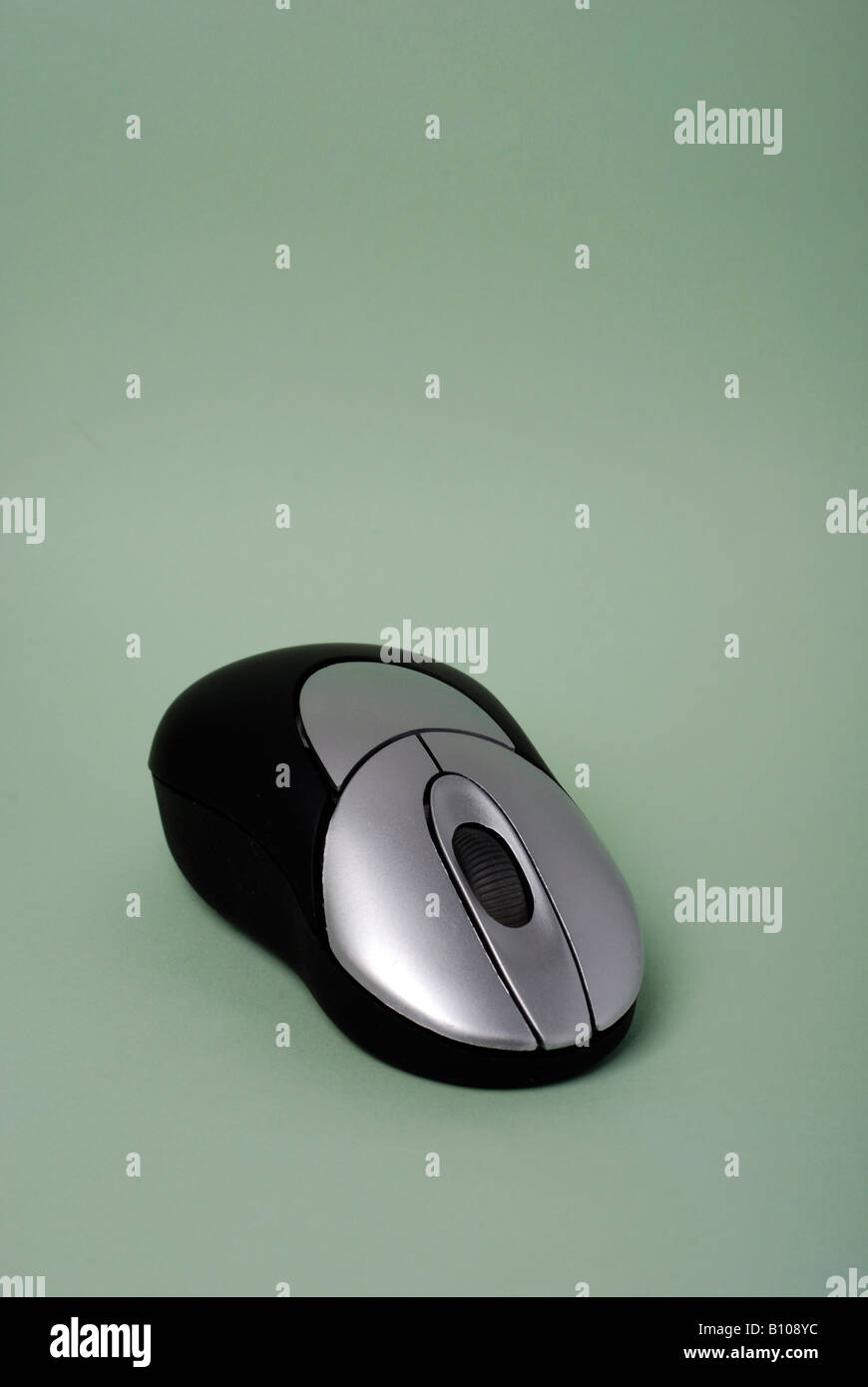 Stock photo of wireless mouse on green background Stock Photo - Alamy