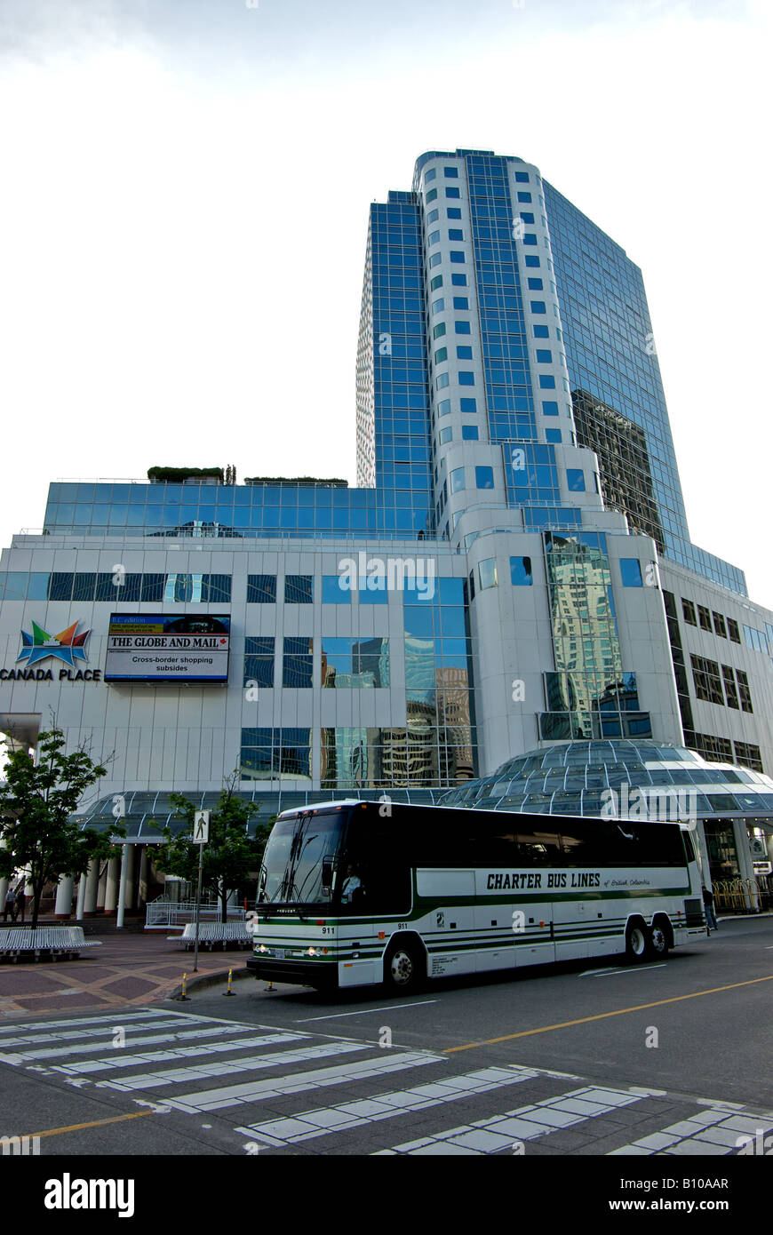 Tour bus parked in front of Canada Place cruise ship terminal and ...