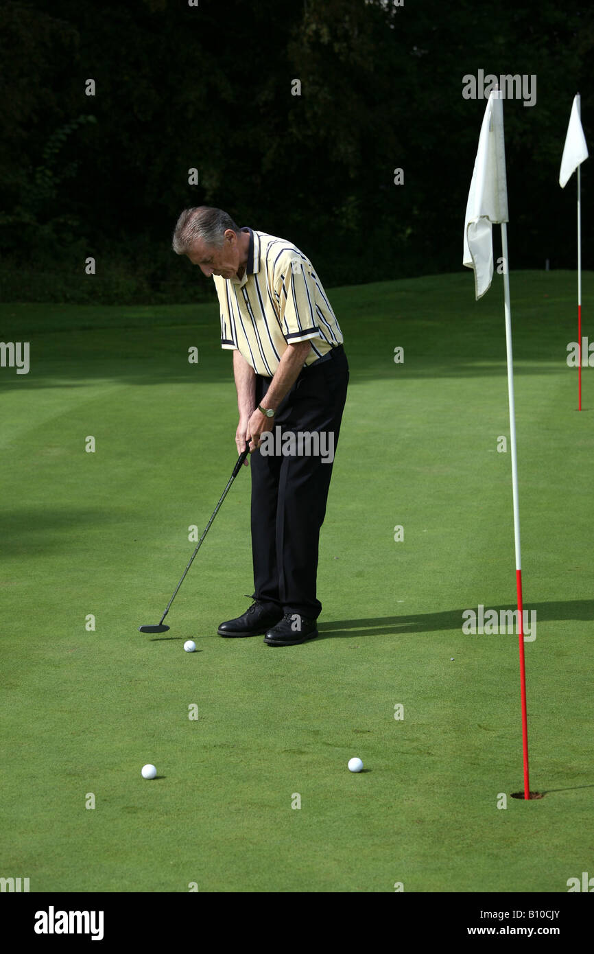 older man playing golf Stock Photo - Alamy