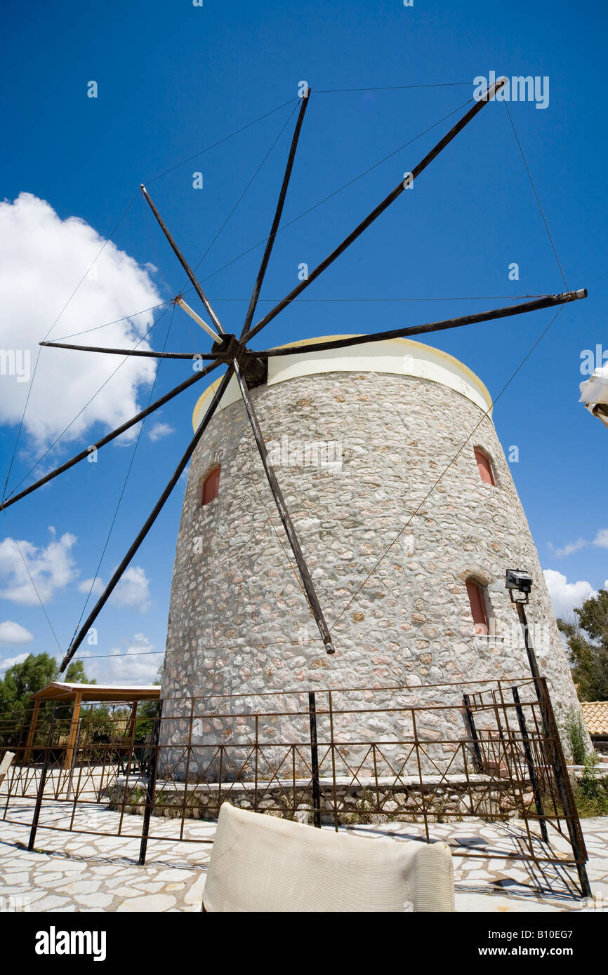 old windmill on the beach in Greece Stock Photo - Alamy