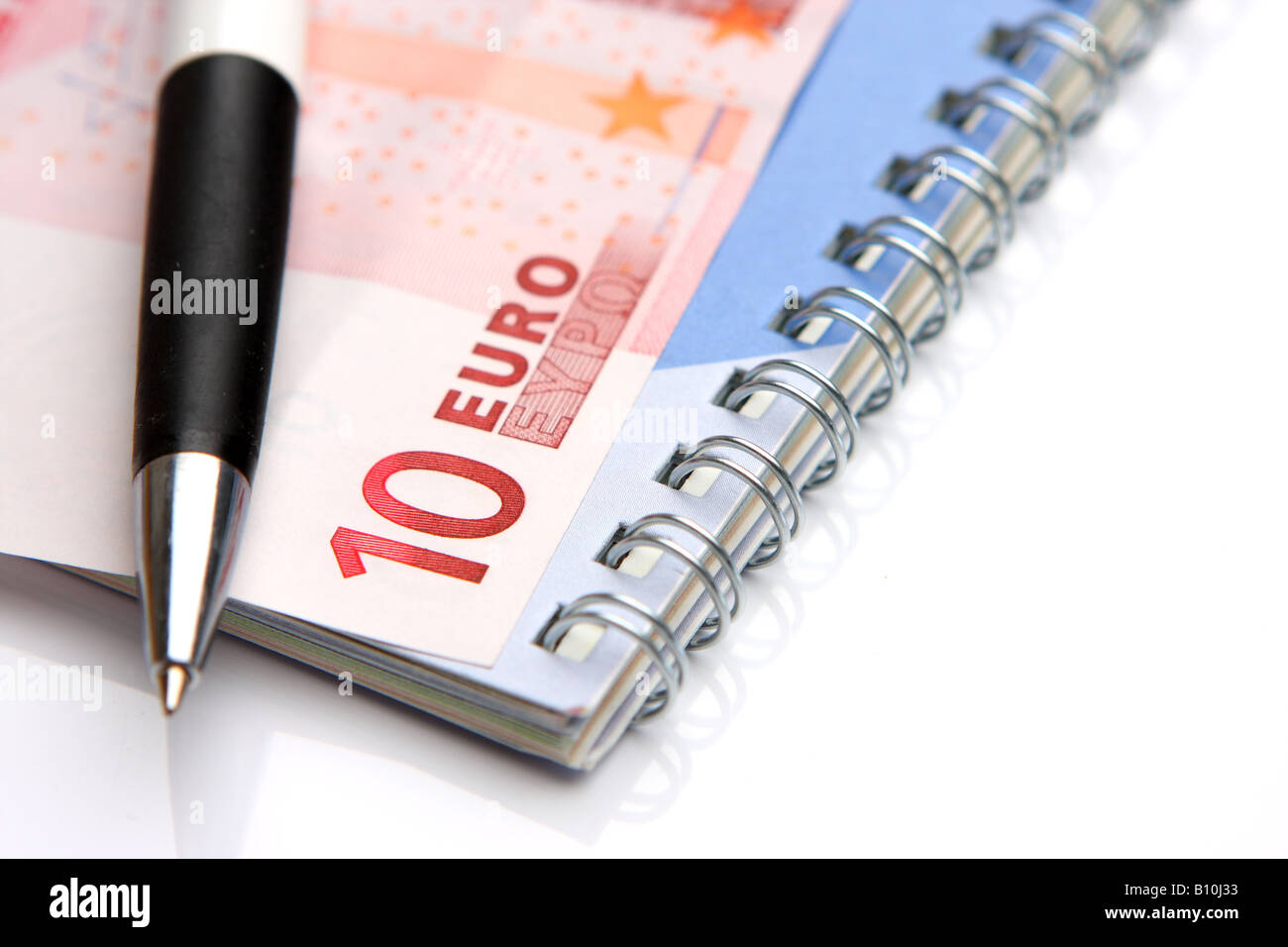 Pen, Bank Note and Notepad Stock Photo - Alamy