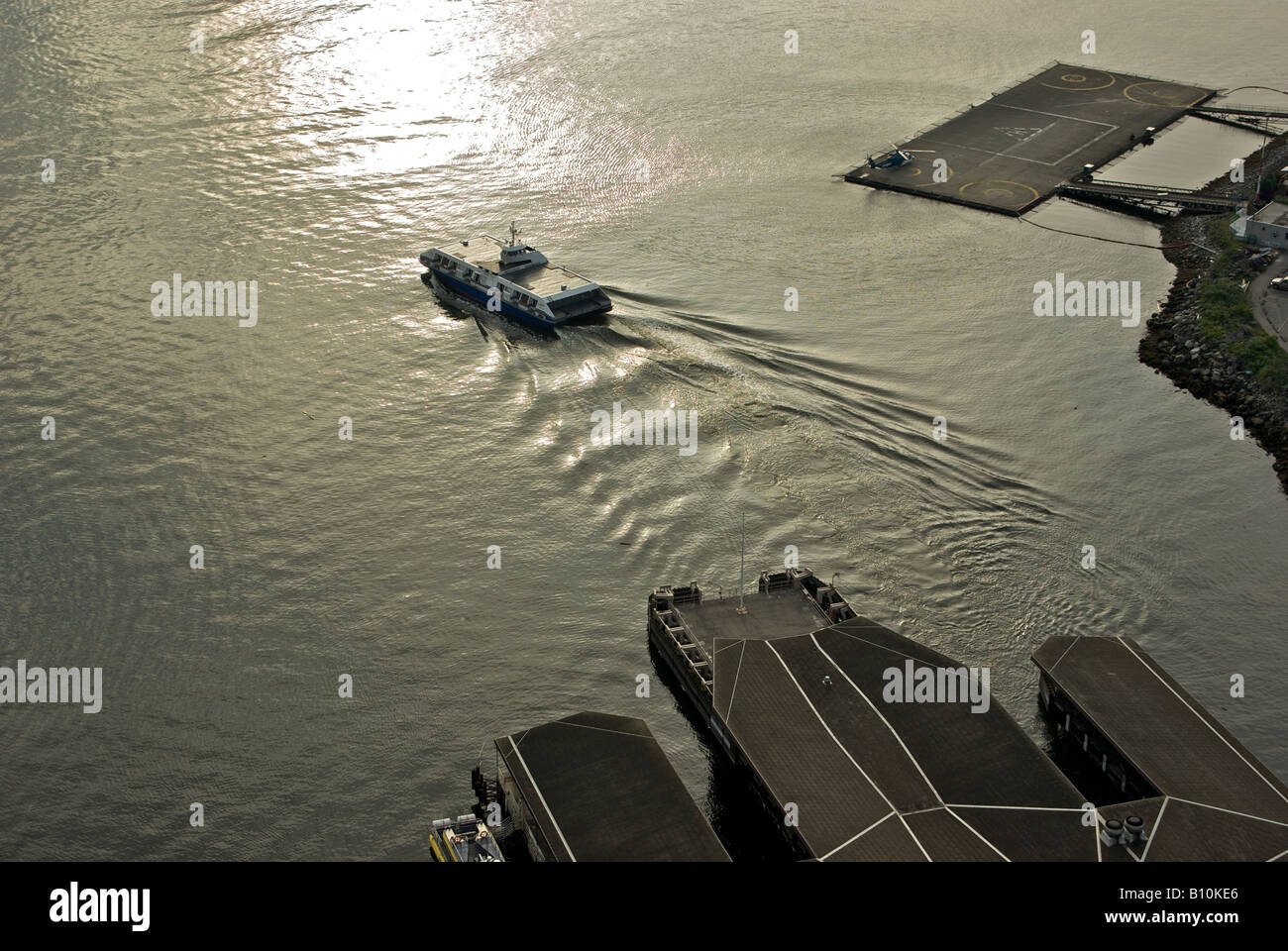 Aerial view of the Seabus leaving its terminal and the heliport on the ...