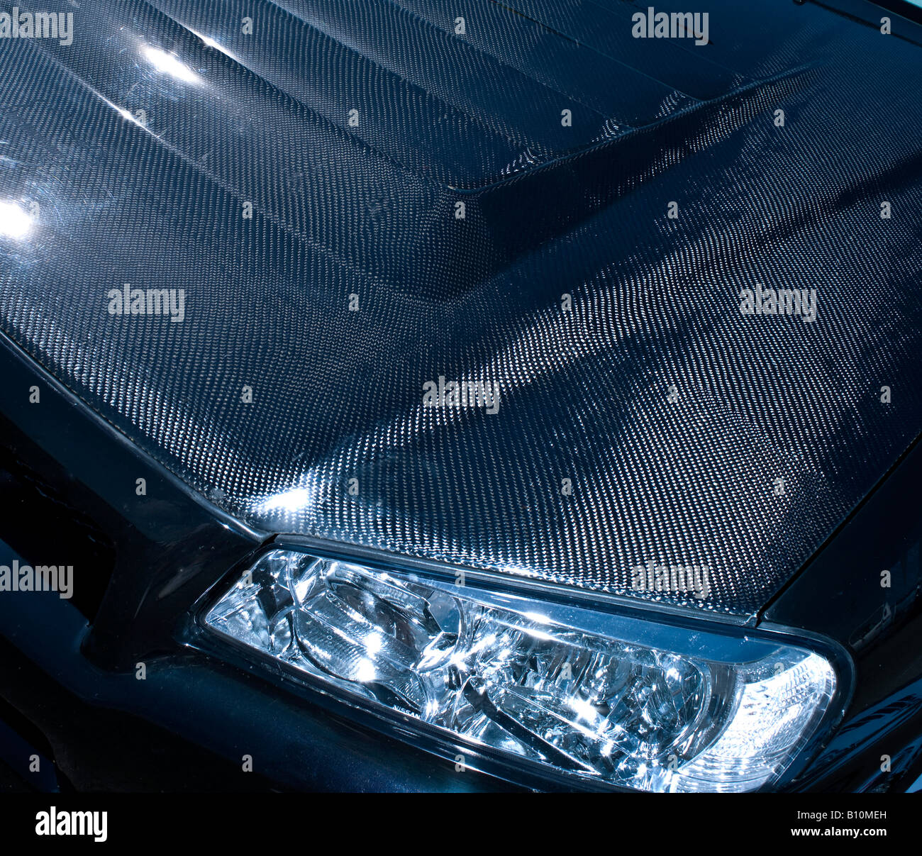 black carbon fibre bonnet hood on modifed car Stock Photo - Alamy