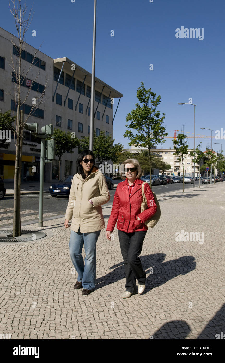 two women walking on the street Stock Photo - Alamy