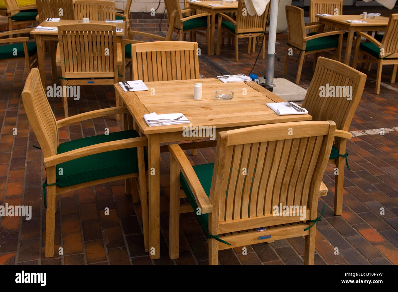 Wooden tables and chairs outside restaurant London UK Stock Photo - Alamy