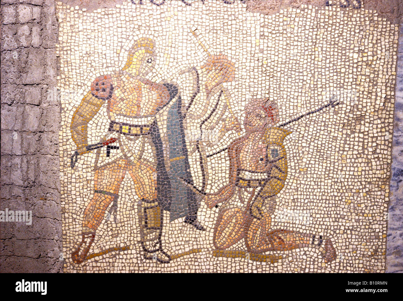 Roman mosaic, Gladiators defeated Retarius kneels, Umpire behind Stock ...