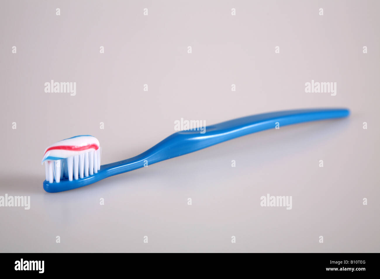 Toothbrush blue bristles toothpaste hi-res stock photography and images ...