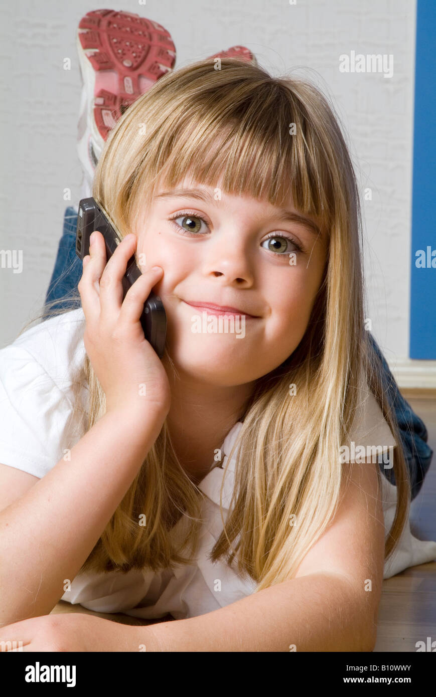 young girl child on mobile telephone phone call calling talking chat ...