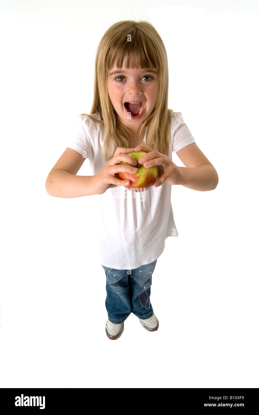 girl young child kid eating an apple fresh fruit diet good food healthy ...