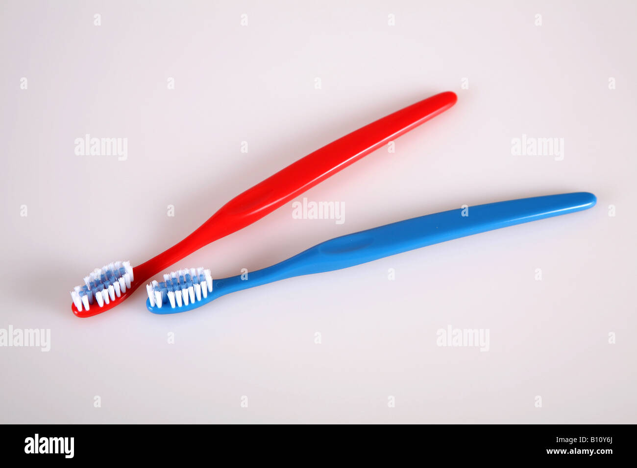 Toothbrush red and blue Stock Photo - Alamy