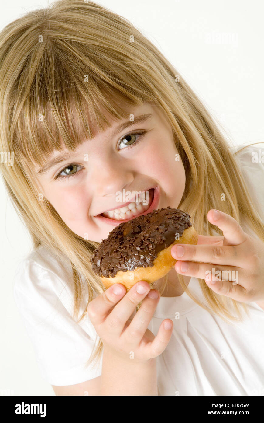 young girl child eating donut cake sweet tooth decay fatty food sugary ...