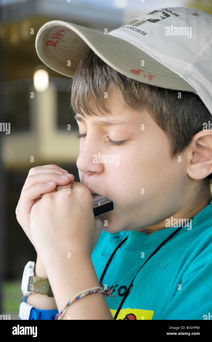 Boy playing harmonica hi-res stock photography and images - Alamy
