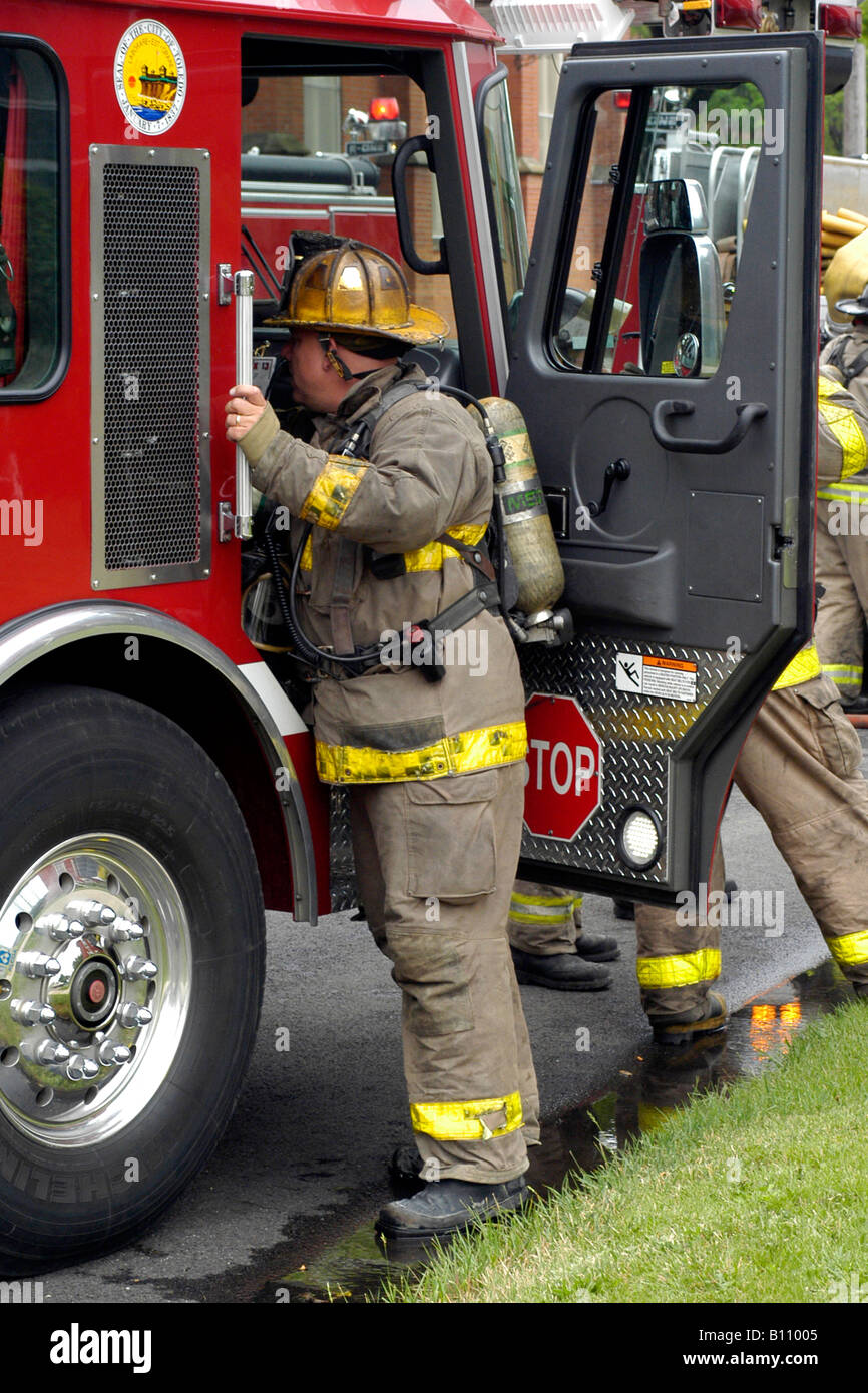 A Fireman at a house fire in downtown Toledo Ohio Stock Photo - Alamy