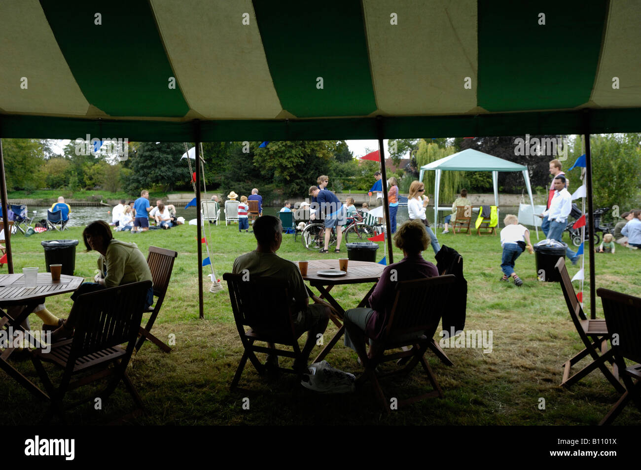People sitting in marquee at fete Stock Photo - Alamy