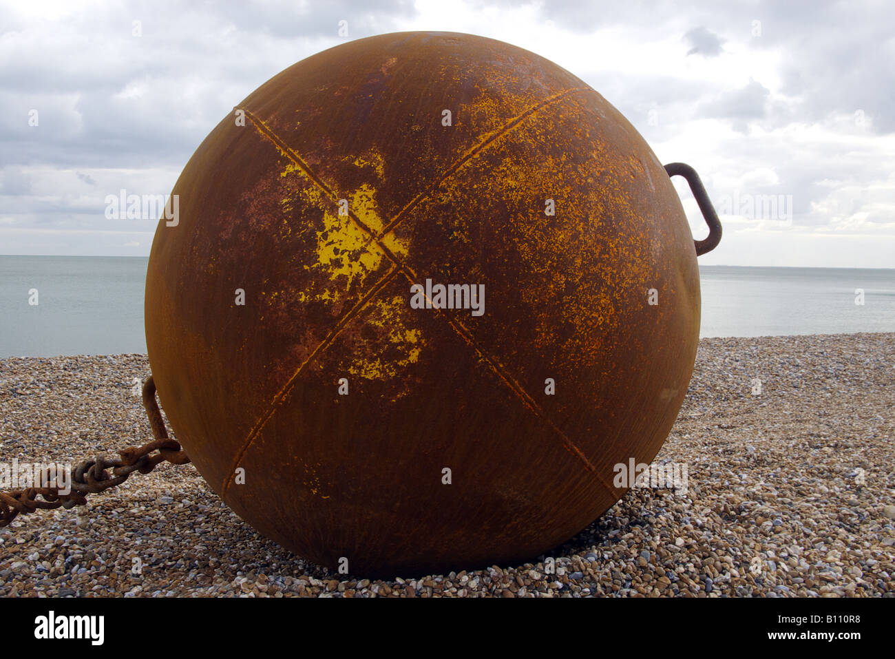 Ball and chain on the beach Stock Photo - Alamy