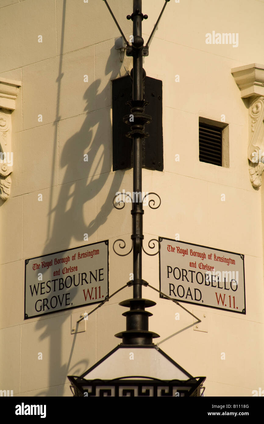 Portobello Road and Westbourne Grove Road Signs on a street corner dusk ...