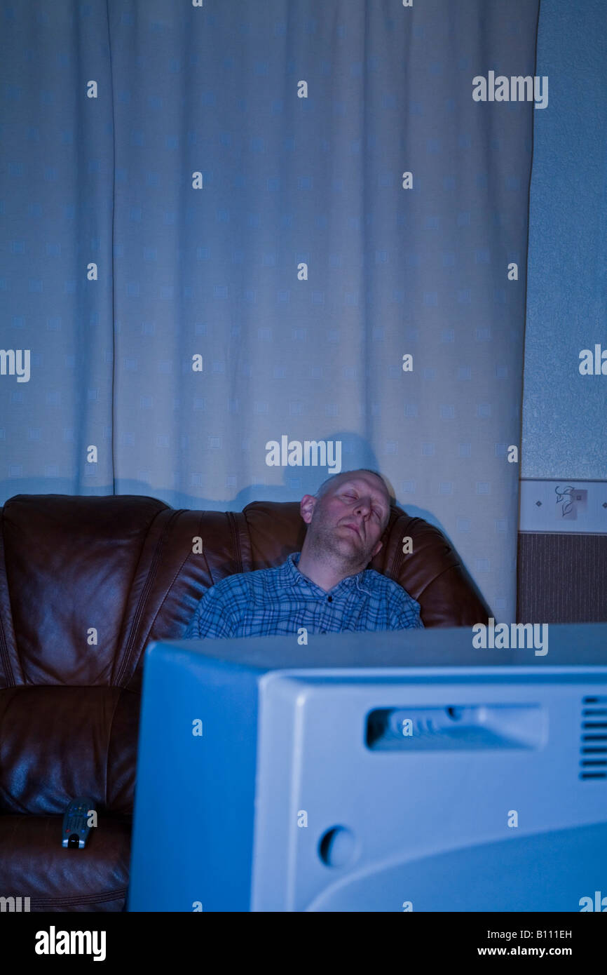 Sleeping in front of tv hi-res stock photography and images - Alamy