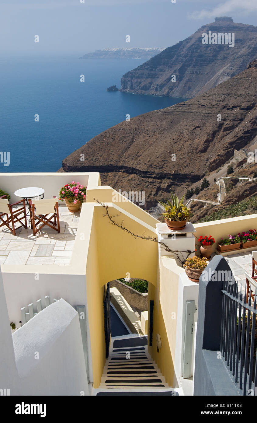 View down a winding staircase set against the cliffs and bay of ...