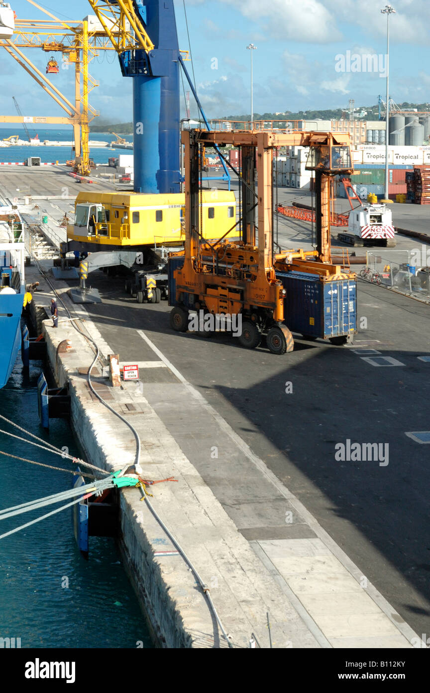 A container being moved by a Shuttle Carrier after being unloaded from ...