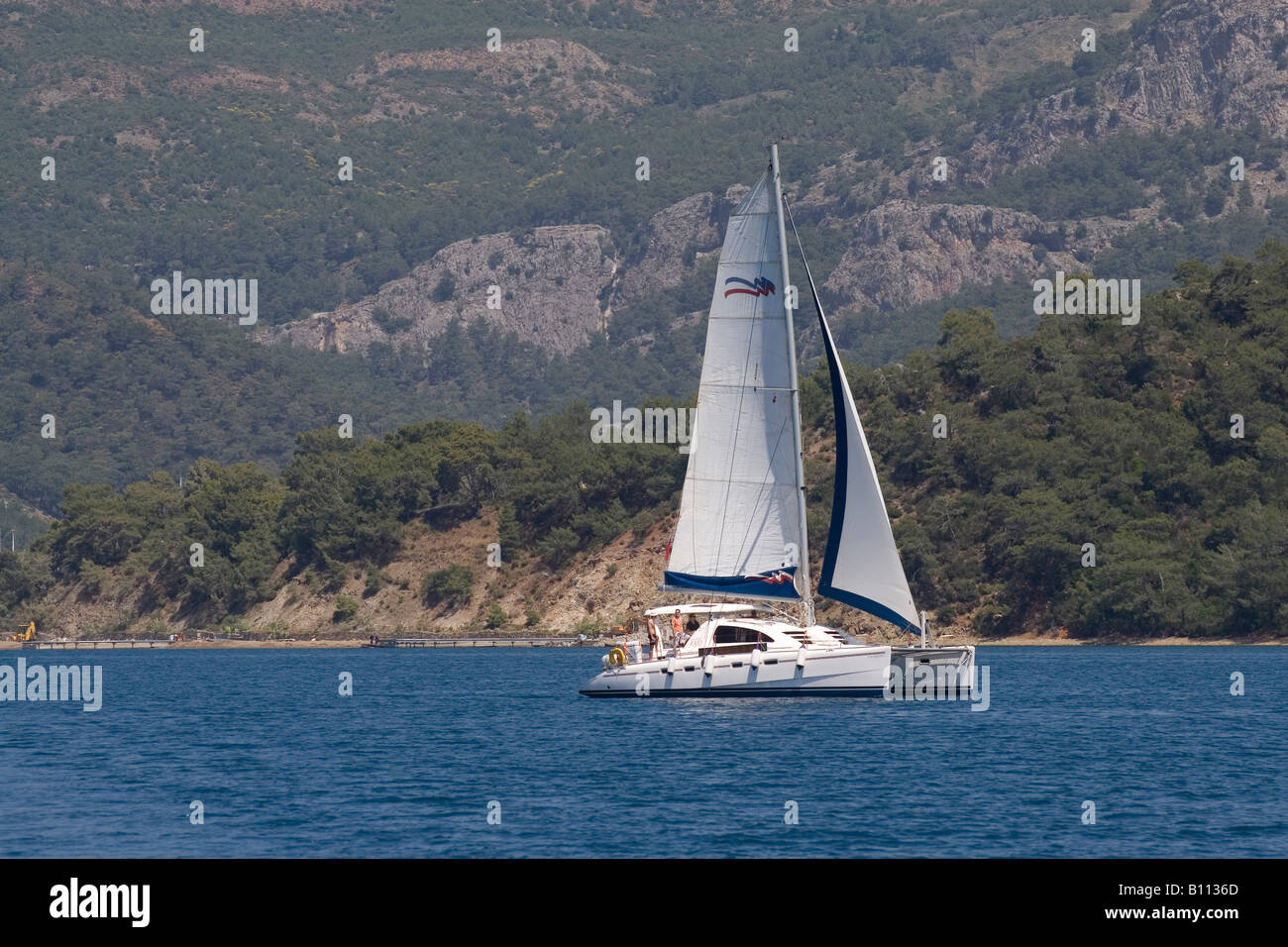 Catamaran sailing in The Bay of Göcek in Turkey Stock Photo - Alamy