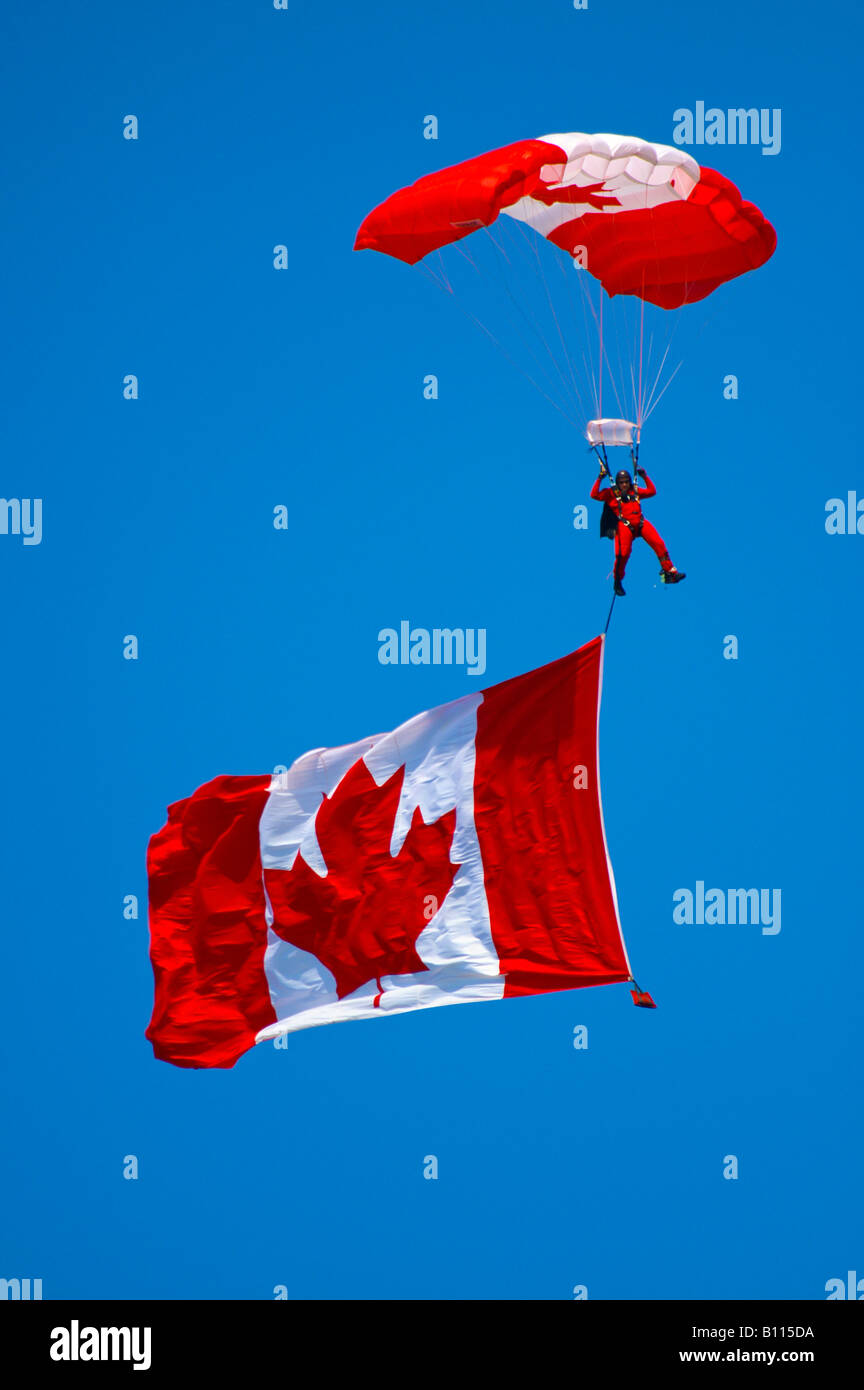 A member of the Canadian Forces Skyhawks parachute team parachutes at ...