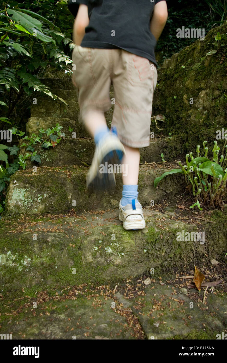 Child running up steps hi-res stock photography and images - Alamy