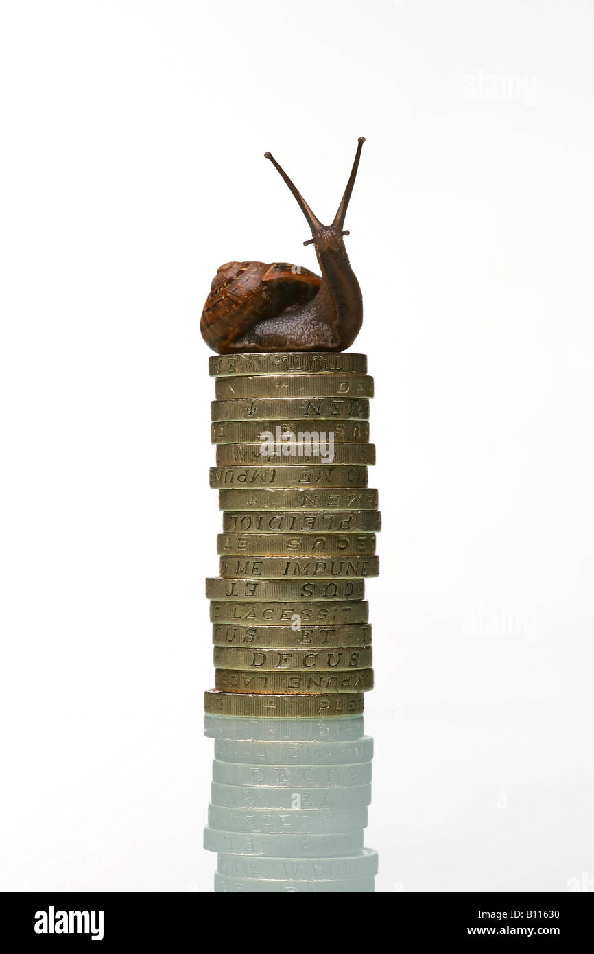 [Snail on pound coins "slow economy"] Stock Photo - Alamy