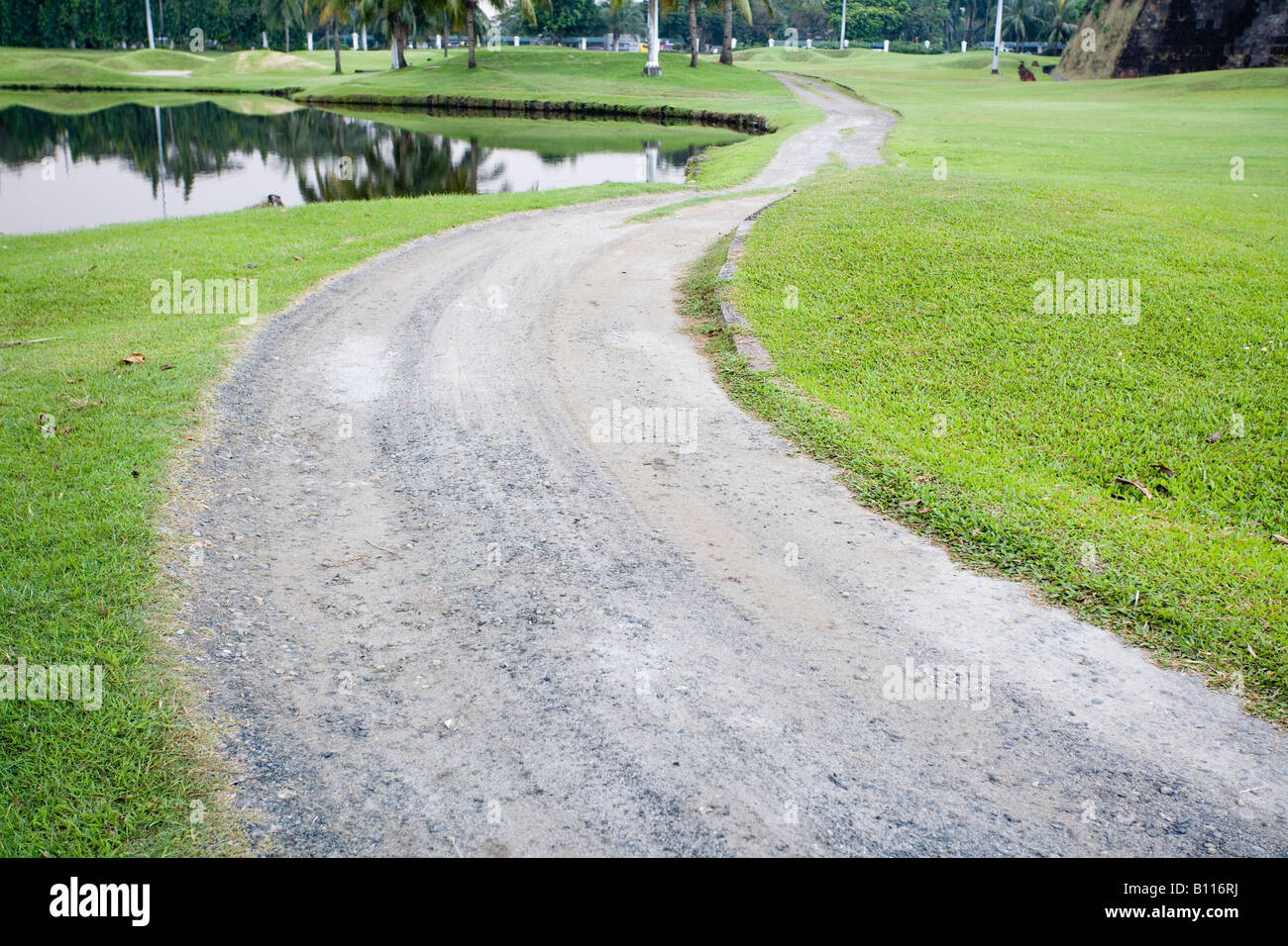 dirt road in a golf course Stock Photo - Alamy