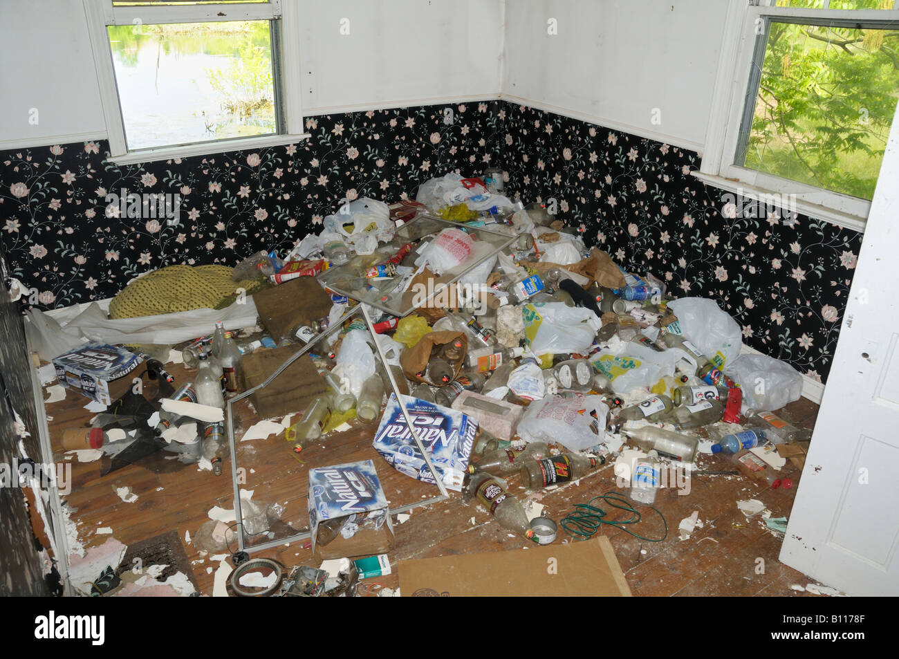 Abandoned house with trash from homeless alcohol drinkers Stock Photo ...