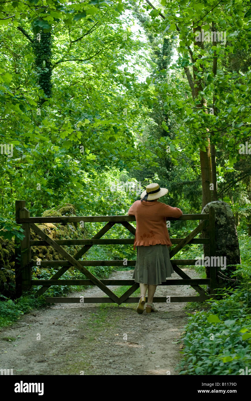 Woman looking over wall hi-res stock photography and images - Alamy