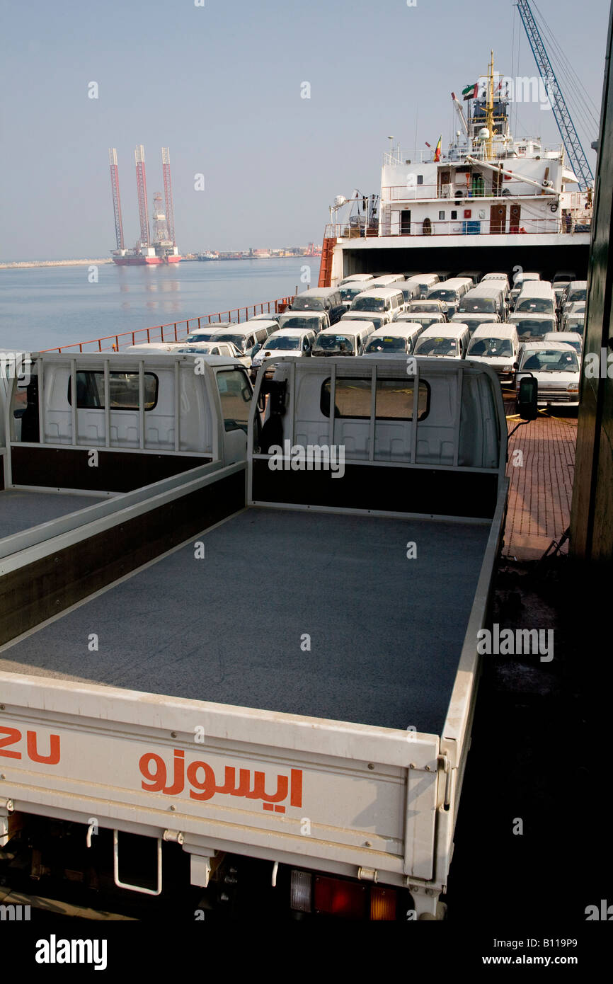 Trucks and lorries loaded on to a ship at Port Khalid United Arab ...