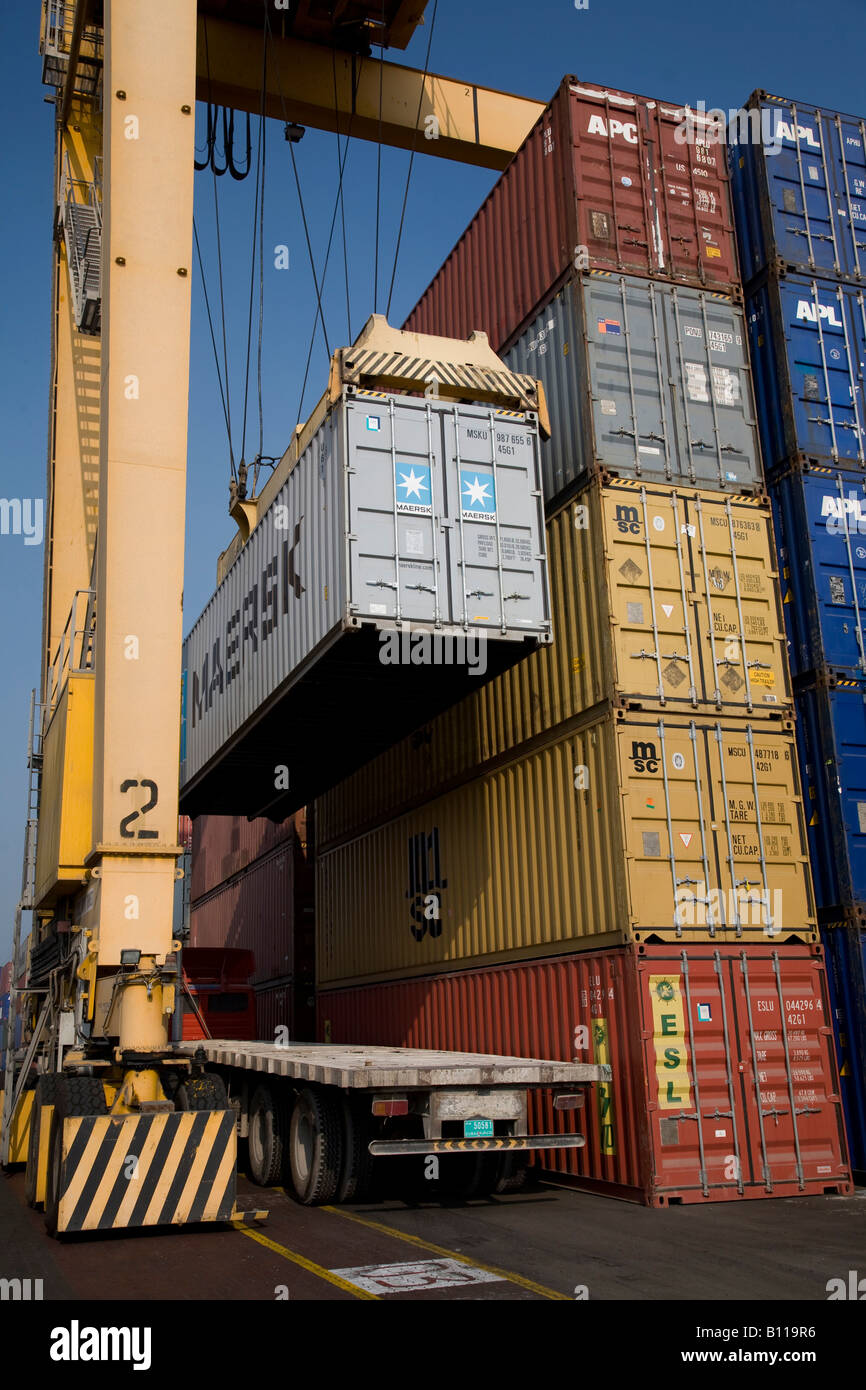 container truck in the container stacks loading container onto flatbed ...