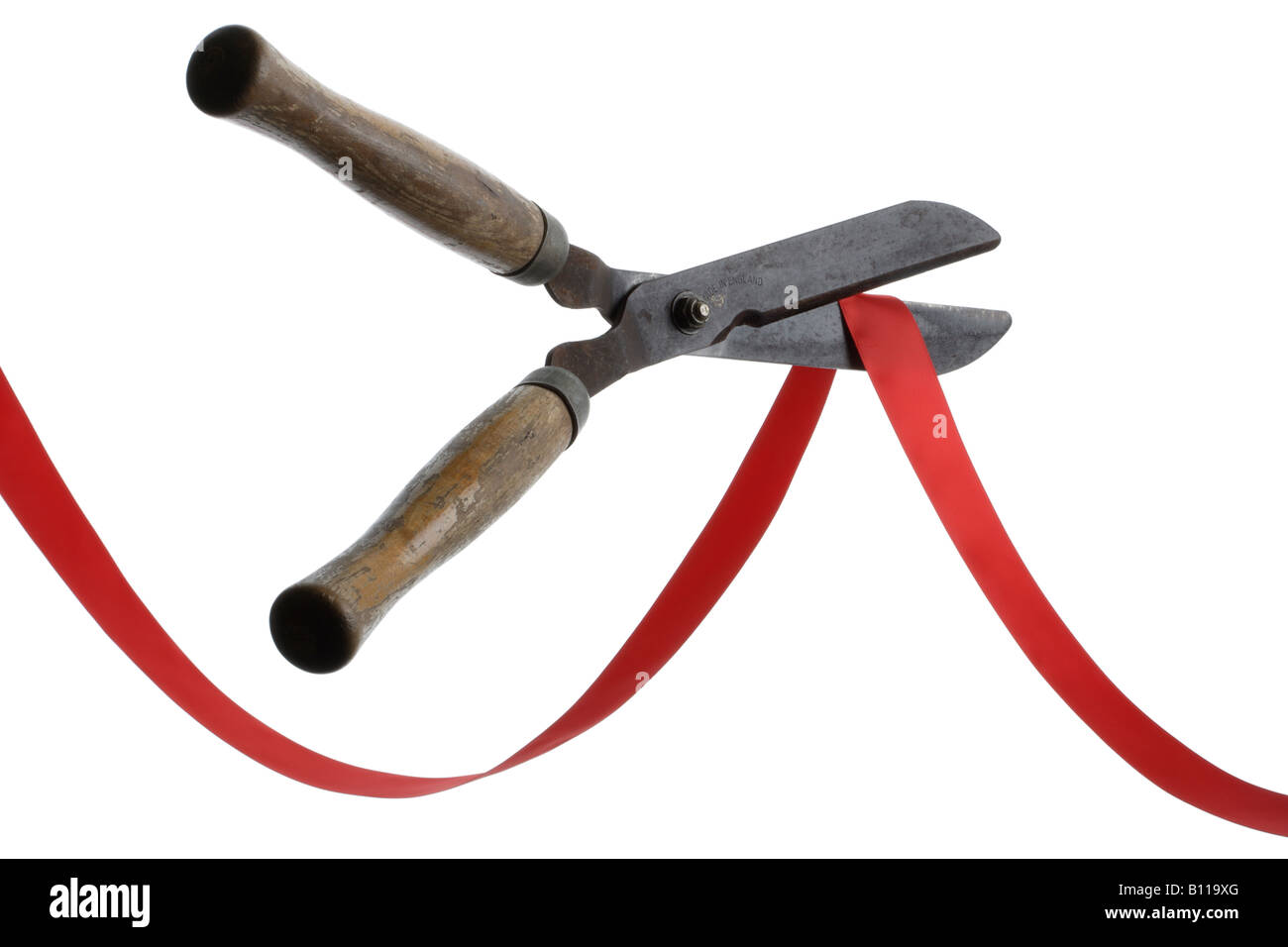 Garden shears cutting red ribbon Stock Photo - Alamy