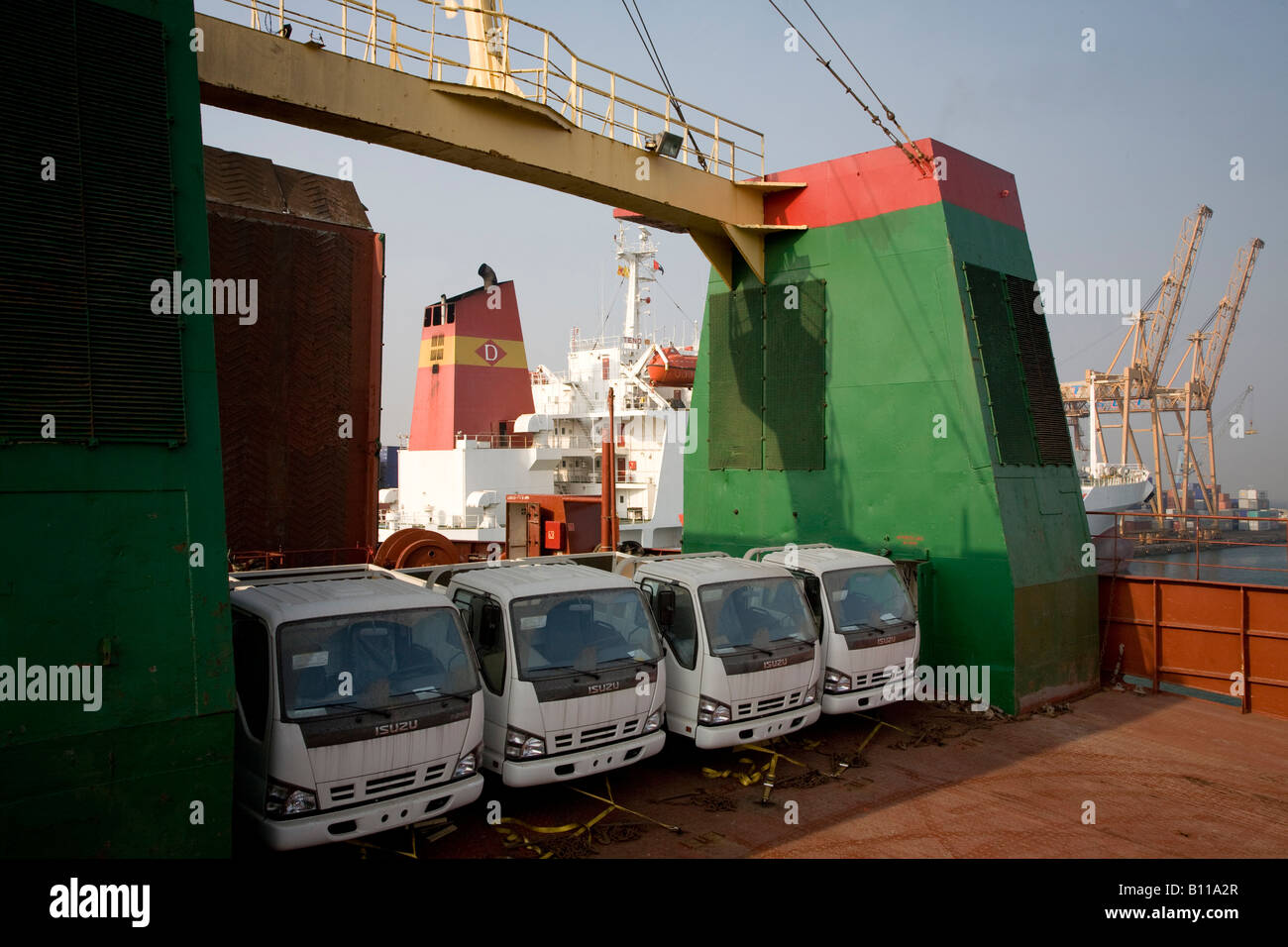 Trucks and lorries loaded on to a ship at Port Khalid United Arab ...