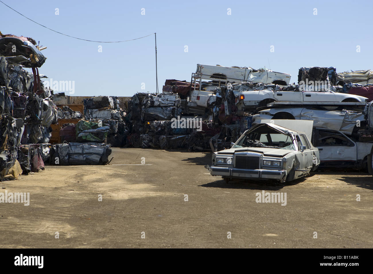 Crushed cars in junkyard Stock Photo - Alamy