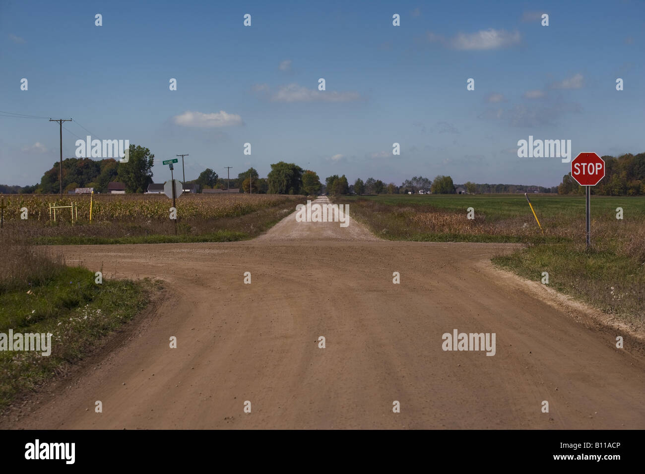 Intersection of rural roads with stop sign Stock Photo - Alamy