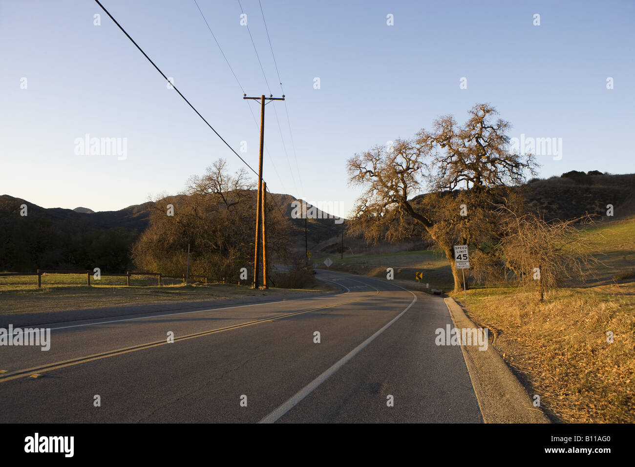 Empty rural road Stock Photo - Alamy