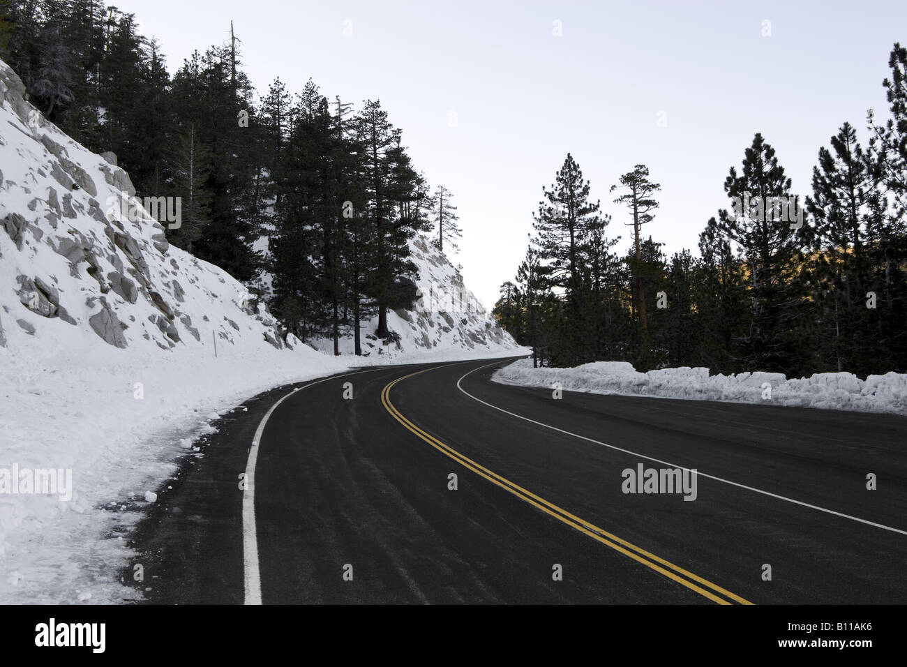Snow cleared mountain road Stock Photo - Alamy
