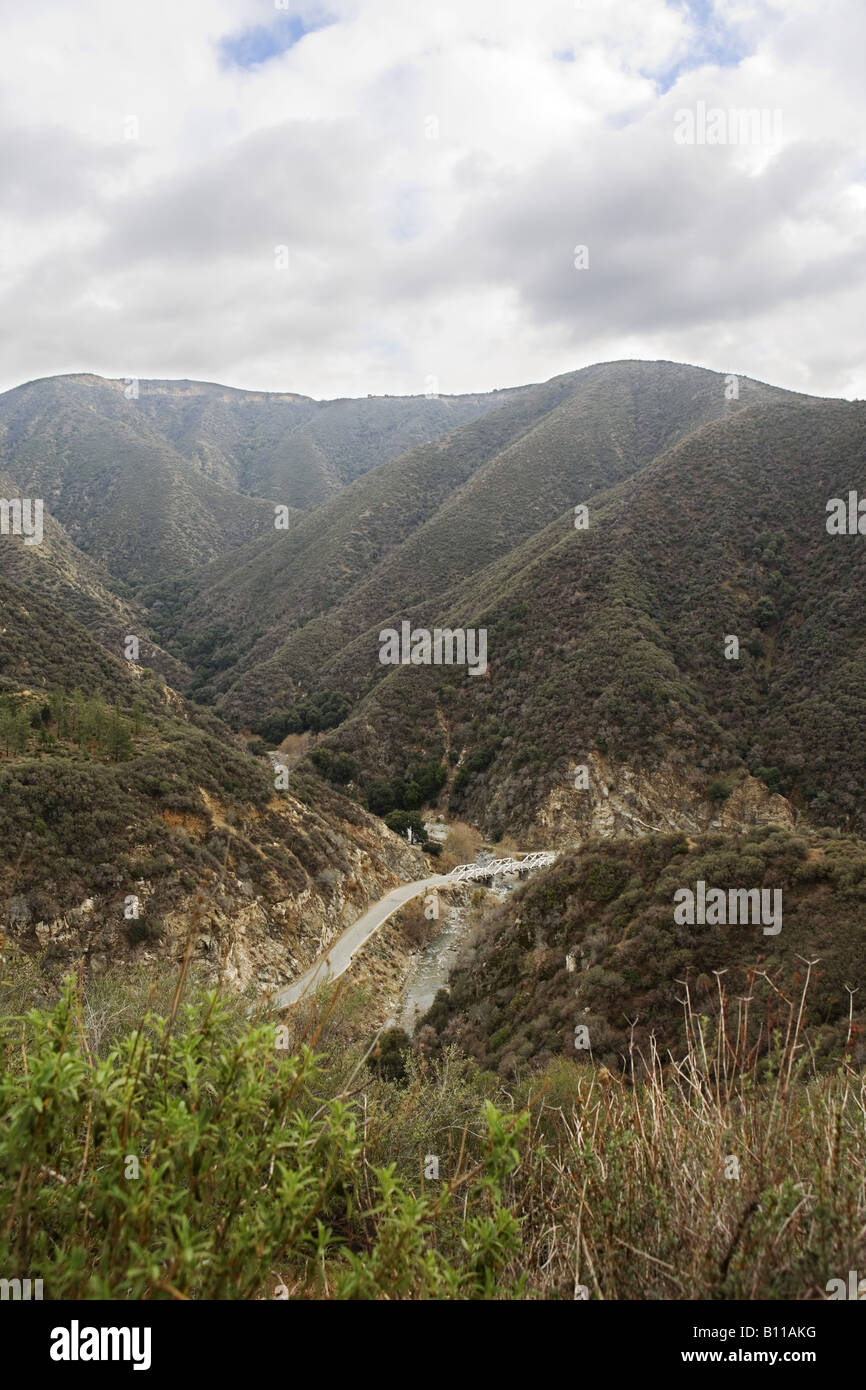 Rural road winding through mountains Stock Photo - Alamy
