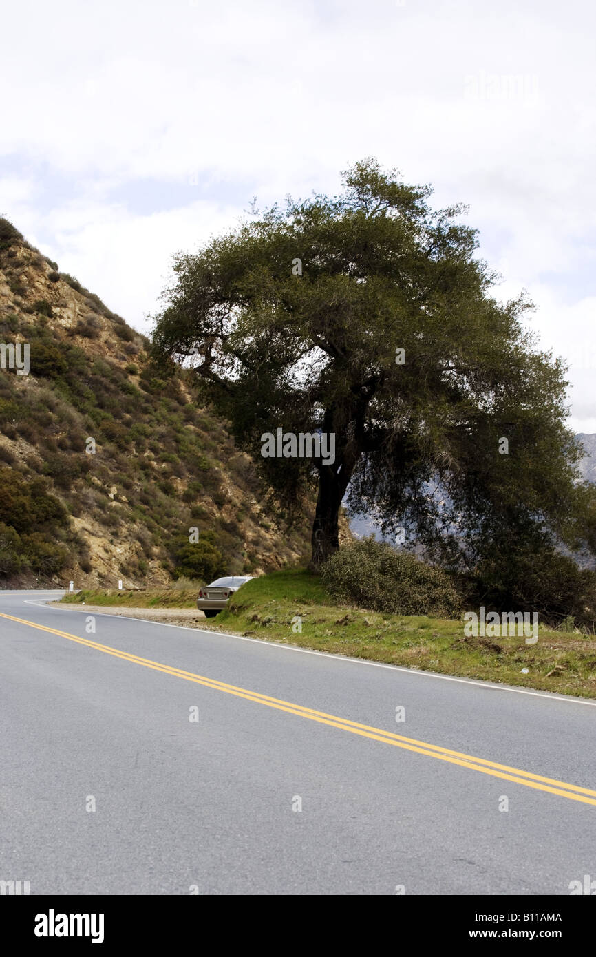 Car parked alongside rural road Stock Photo - Alamy