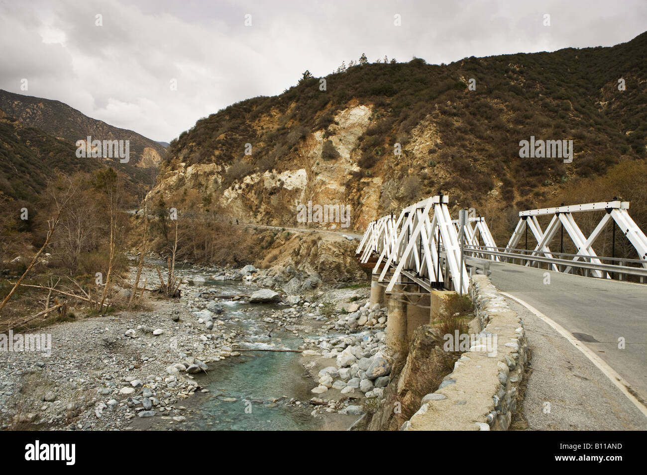 Bridge crossing stream on mountain road Stock Photo - Alamy