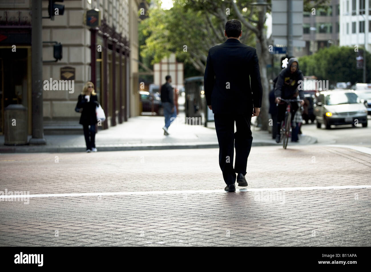 Man crossing street Stock Photo - Alamy